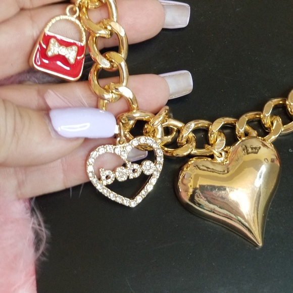 bebe | Jewelry | Bebe Gold Heart And Charms On Chunky Link Gold ...